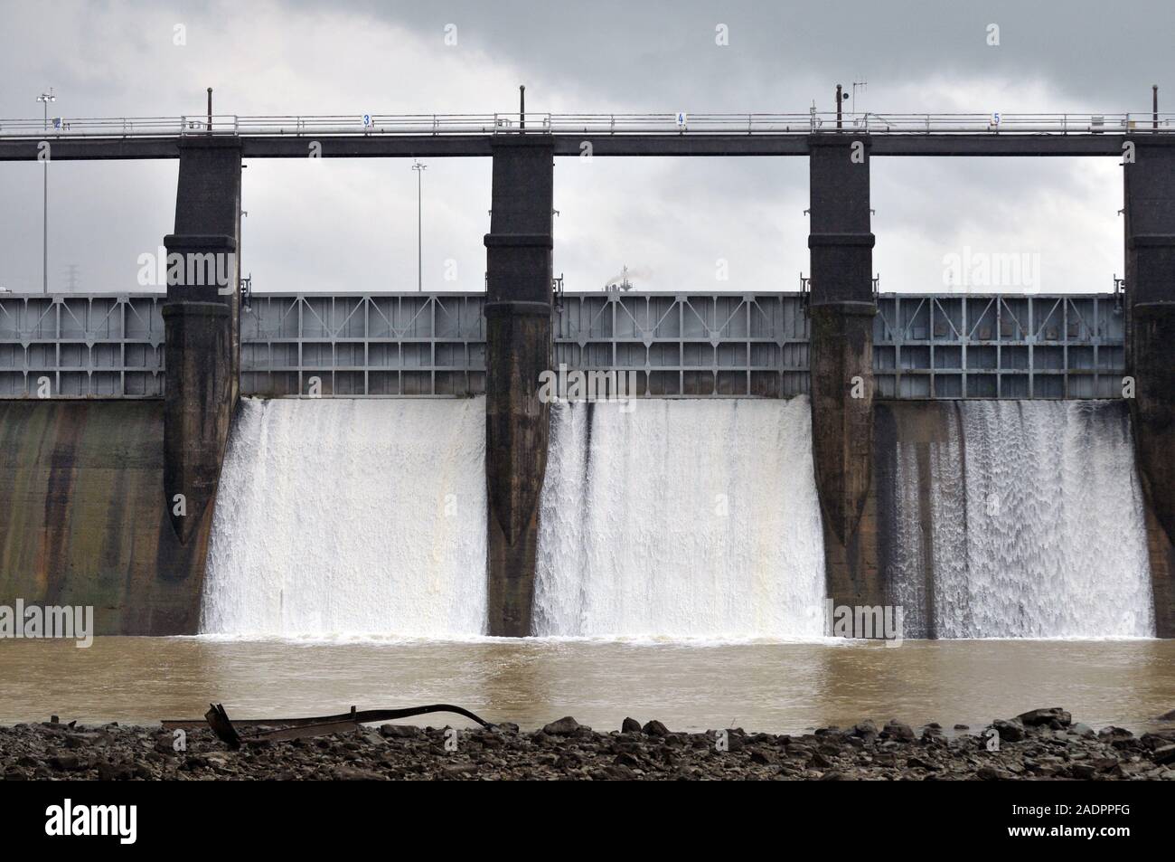 Floodgates release water from dammed reservoir creating multiple ...
