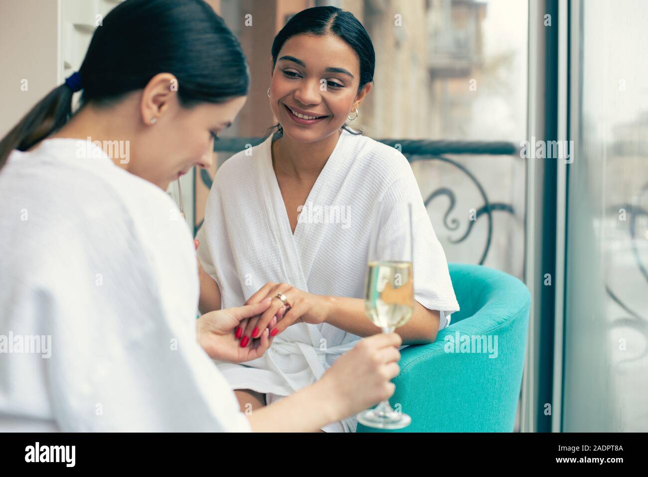Positive woman feeling pleased and showing her engagement ring Stock ...
