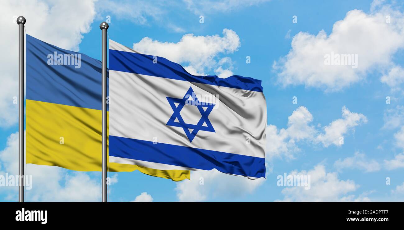 Ukraine and Israel flag waving in the wind against white cloudy blue ...