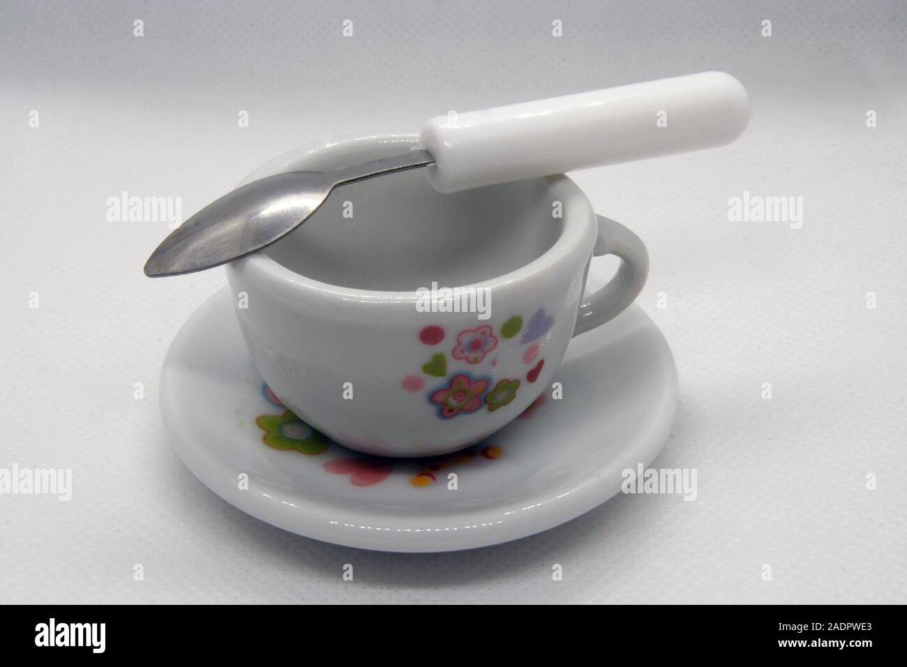 Miniature model of a tea cup. Kids playing tea set Stock Photo - Alamy