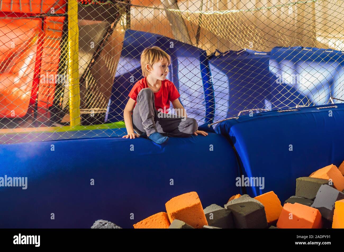 Little boy have fun jumping on trampolines Stock Photo - Alamy