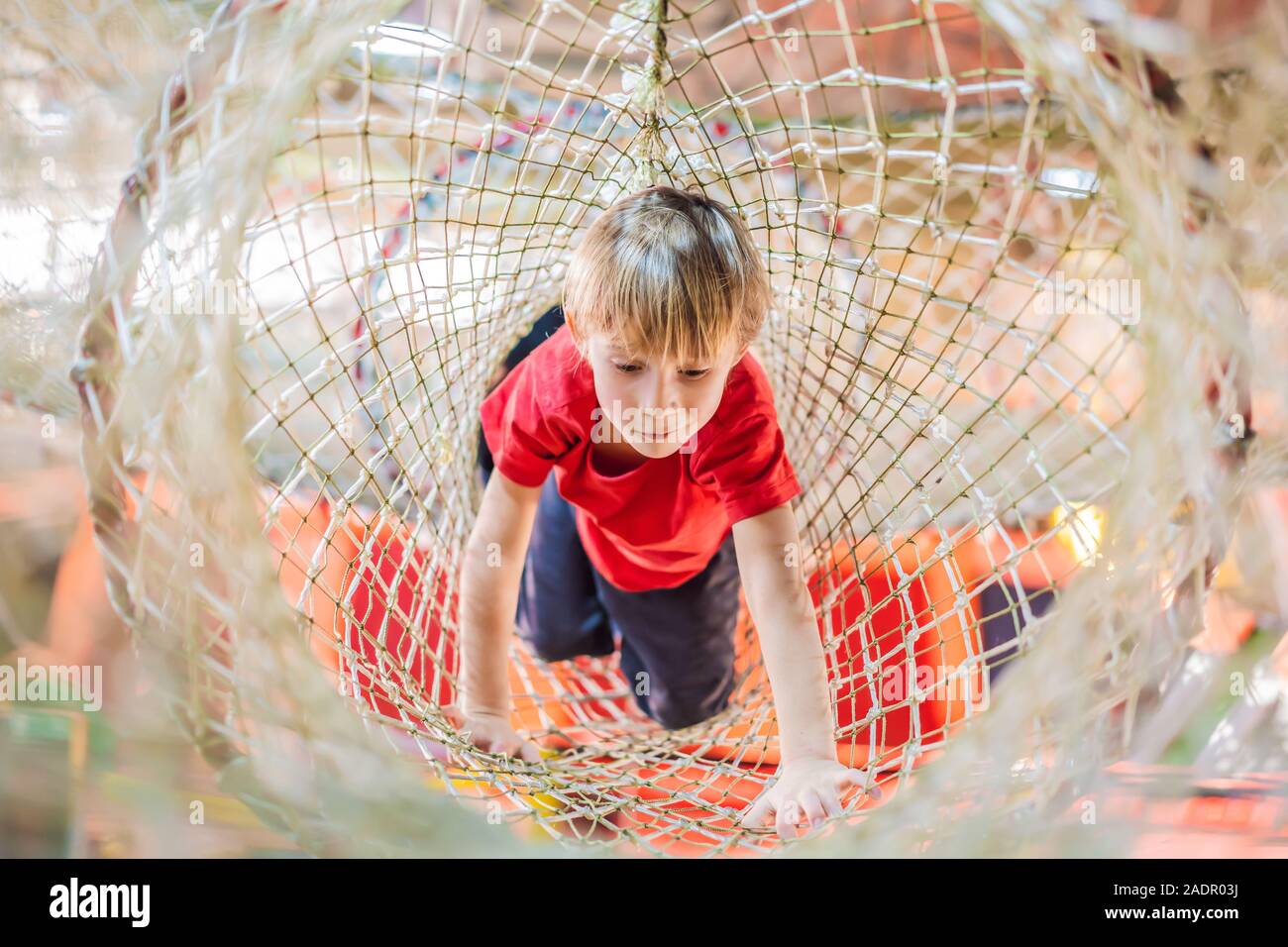 Boy playing on obstacle course hi-res stock photography and images - Alamy