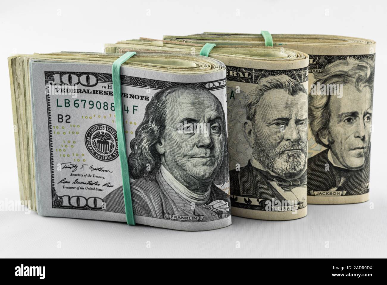 Three Bill folds of cash featuring Presidents of the United States ...