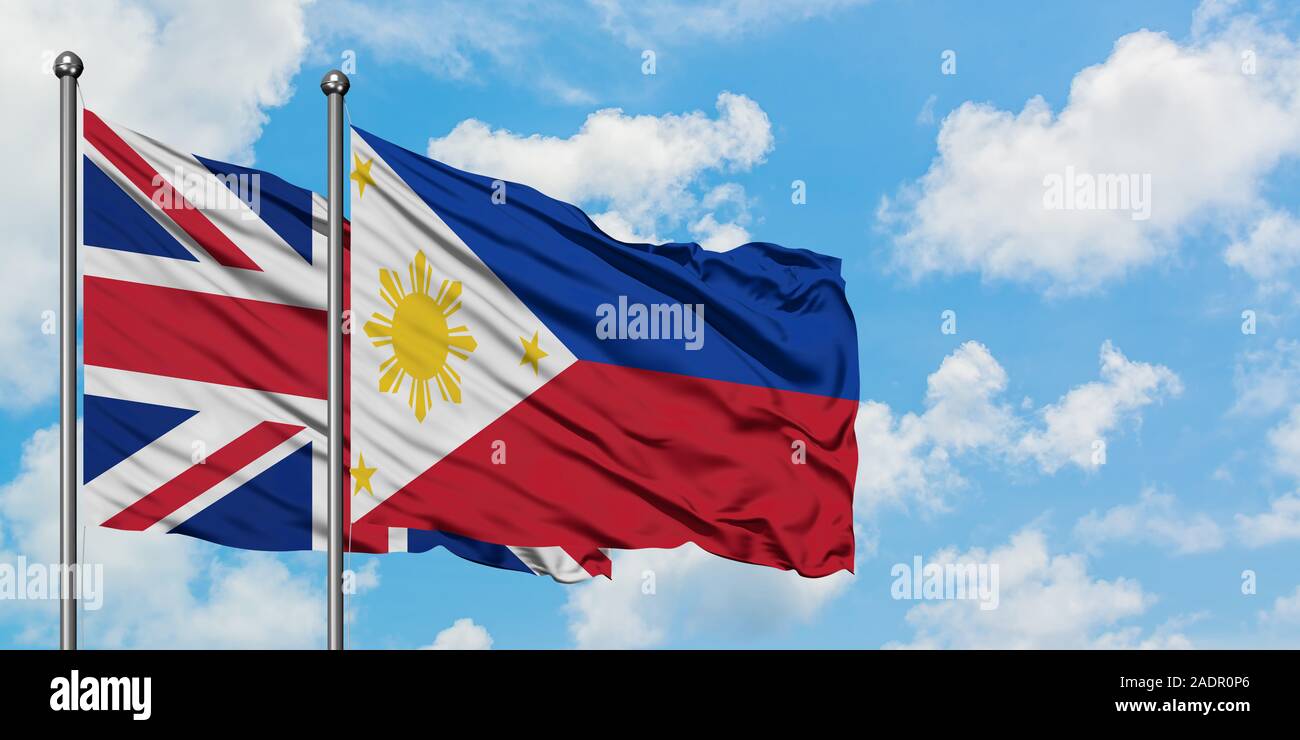 United Kingdom and Philippines flag waving in the wind against white ...