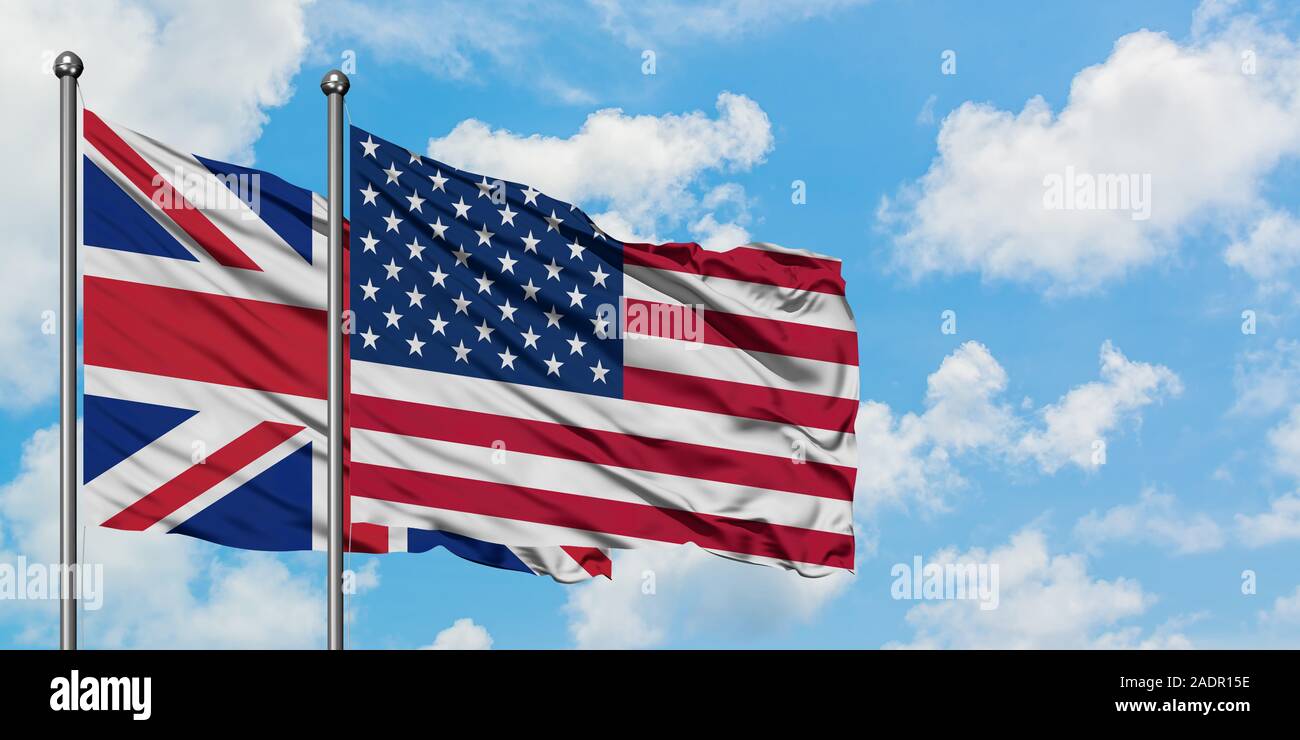United Kingdom and United States flag waving in the wind against white ...
