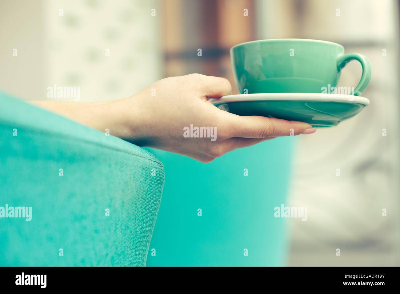 Cup in hand hi-res stock photography and images - Alamy