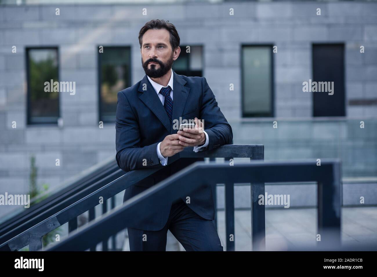 Man leaning on handrail hi-res stock photography and images - Alamy