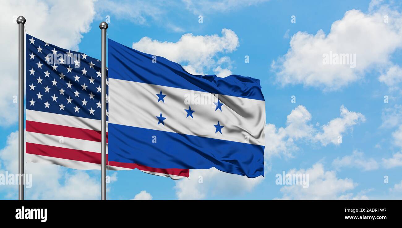 United States and Honduras flag waving in the wind against white cloudy ...