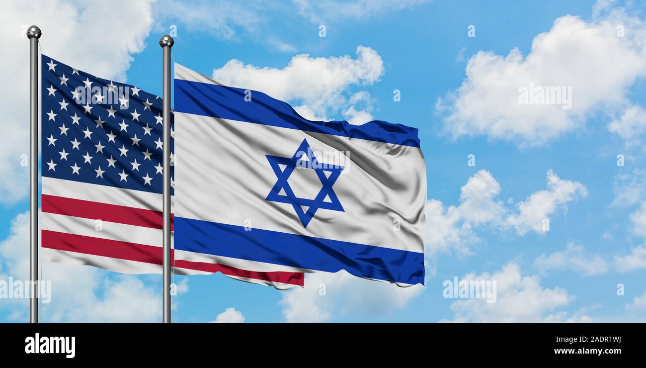 United States and Israel flag waving in the wind against white cloudy ...