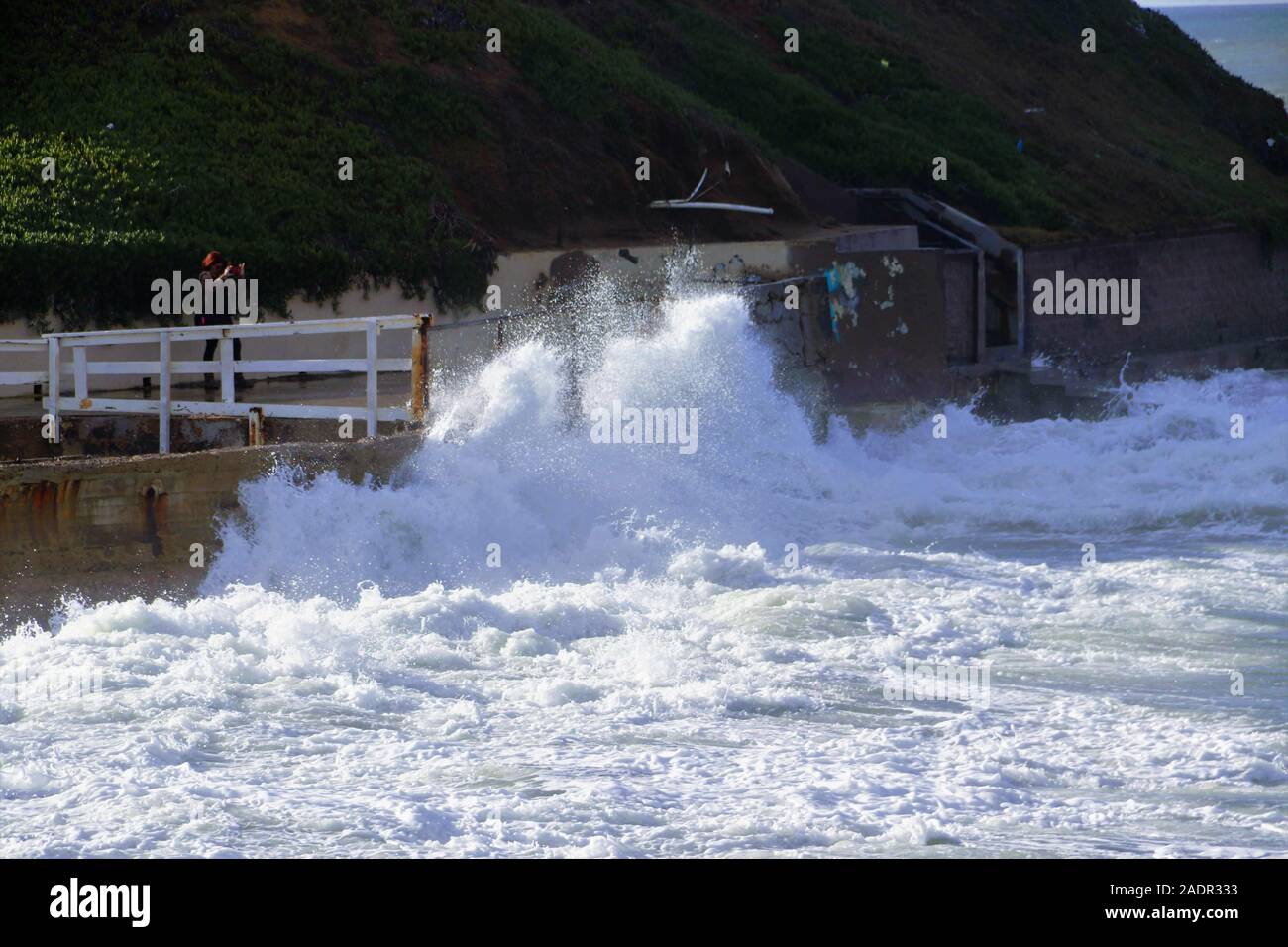 High Tide at Ocean Beach Pier Stock Photo - Alamy