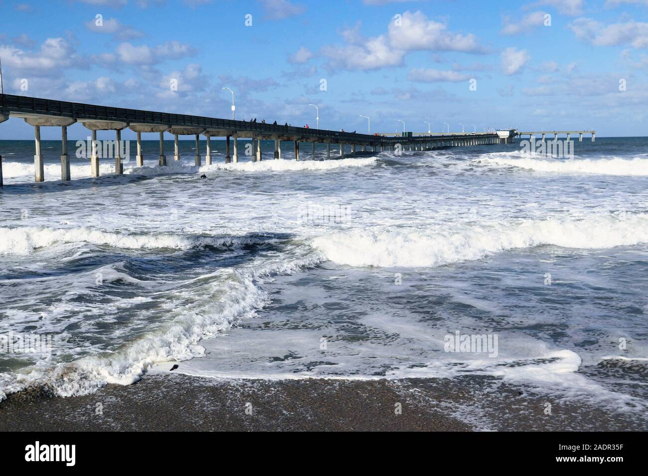 High Tide at Ocean Beach Pier Stock Photo - Alamy