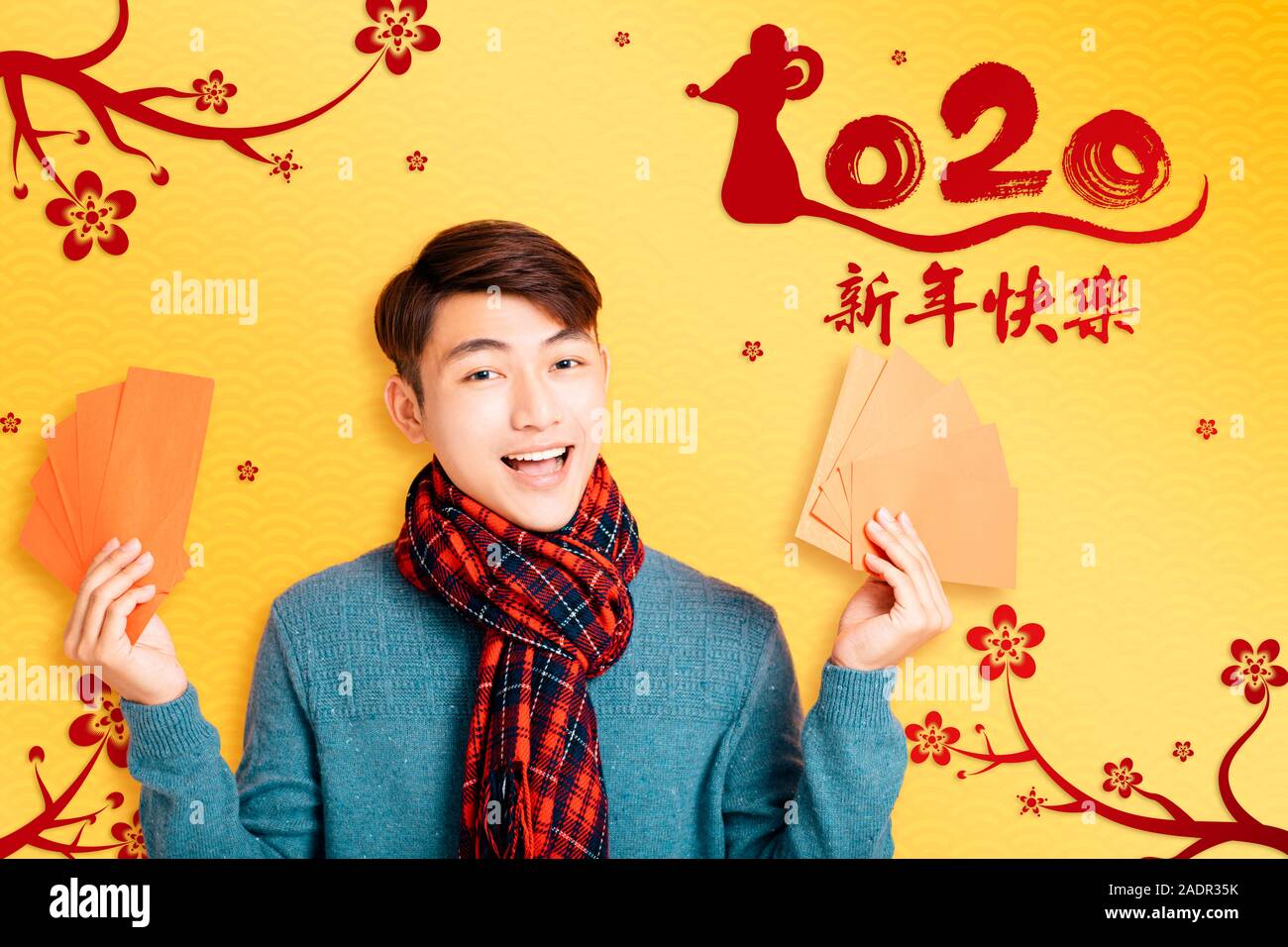 asian young man celebrating for chinese new year. chinese text happy ...