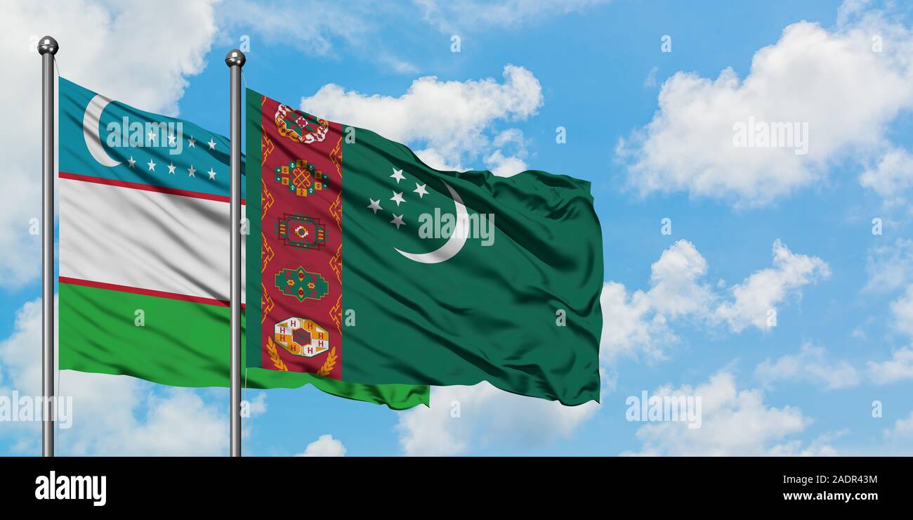 Uzbekistan And Turkmenistan Flag Waving In The Wind Against White