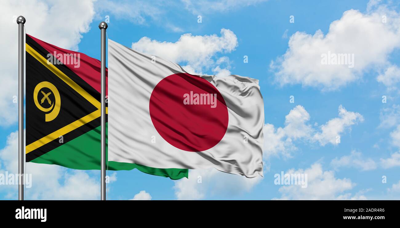 Vanuatu and Japan flag waving in the wind against white cloudy blue sky ...
