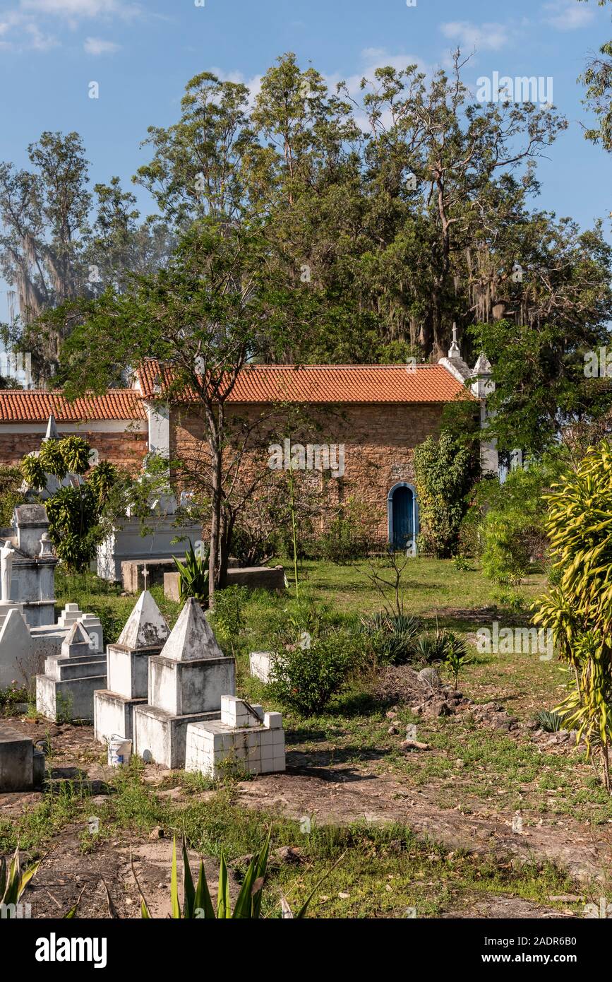 View to byzantine style white tomb stones on cemetery next to colonial ...