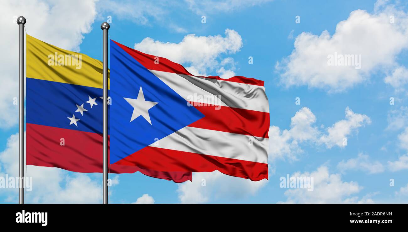 Venezuela and Puerto Rico flag waving in the wind against white cloudy ...