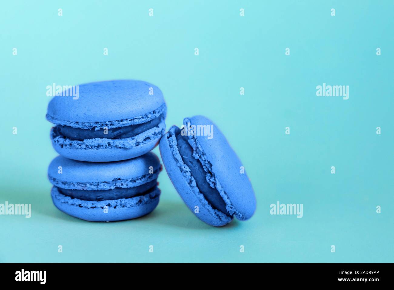 Sweet almond macaron or macaroon dessert cake colored in trendy color ...