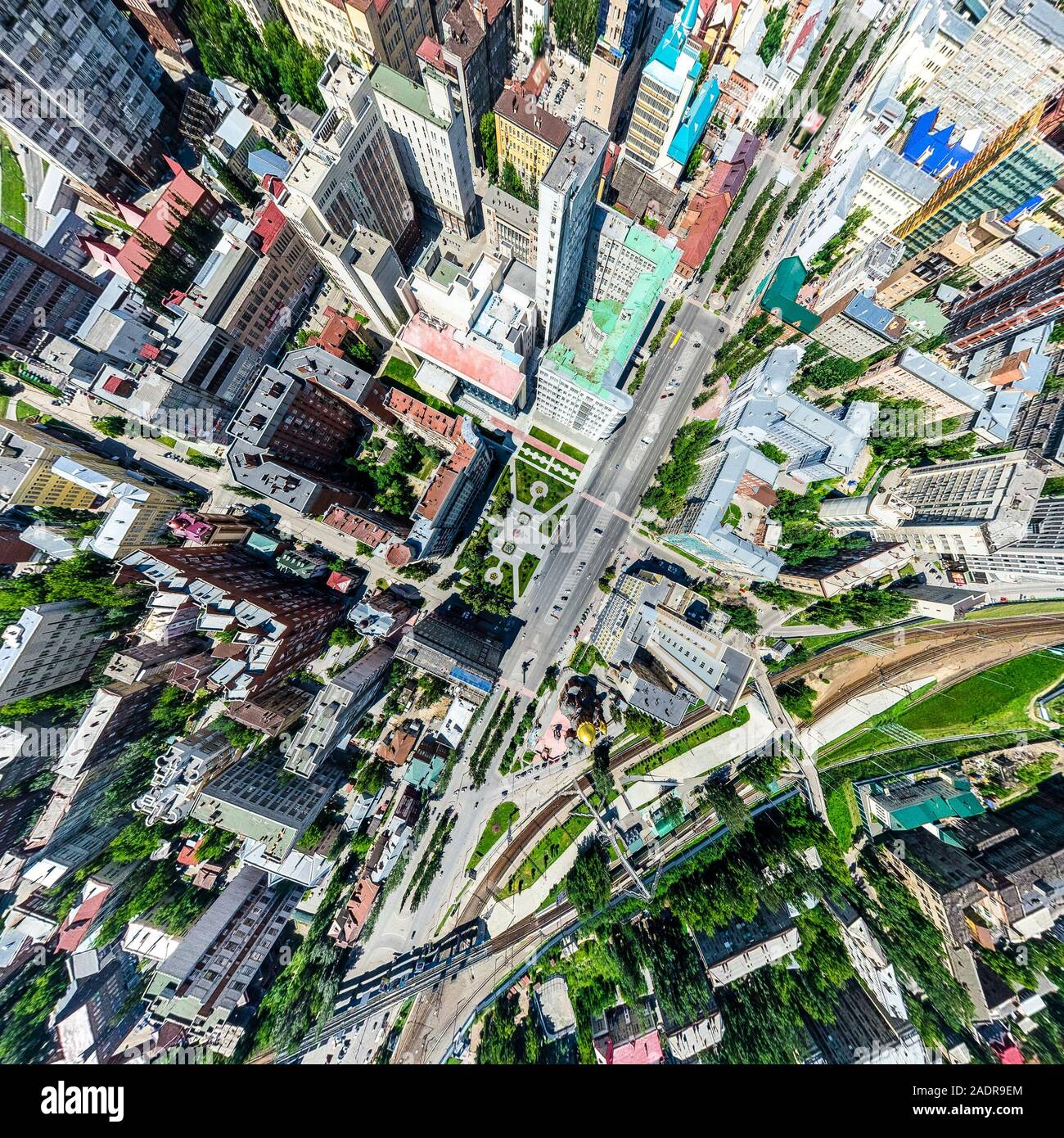 Aerial city view with crossroads and roads, houses, buildings, parks ...