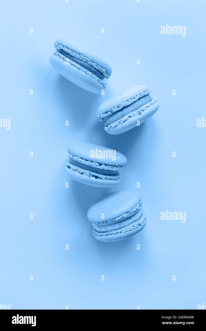 Sweet almond macaron or macaroon dessert cake colored in trendy color ...