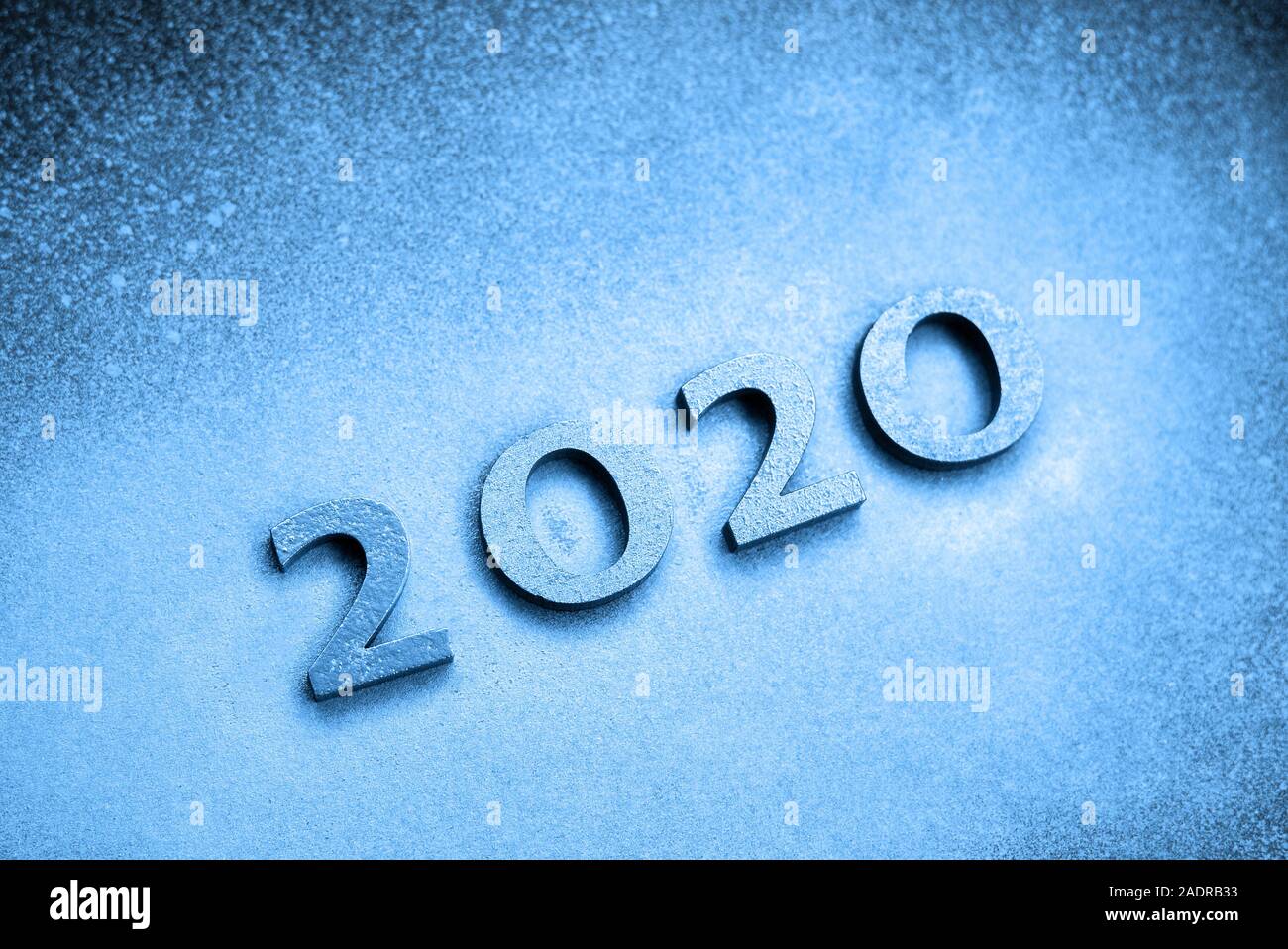 2020 blue color trend. Number 2020 against shiny glowing background ...