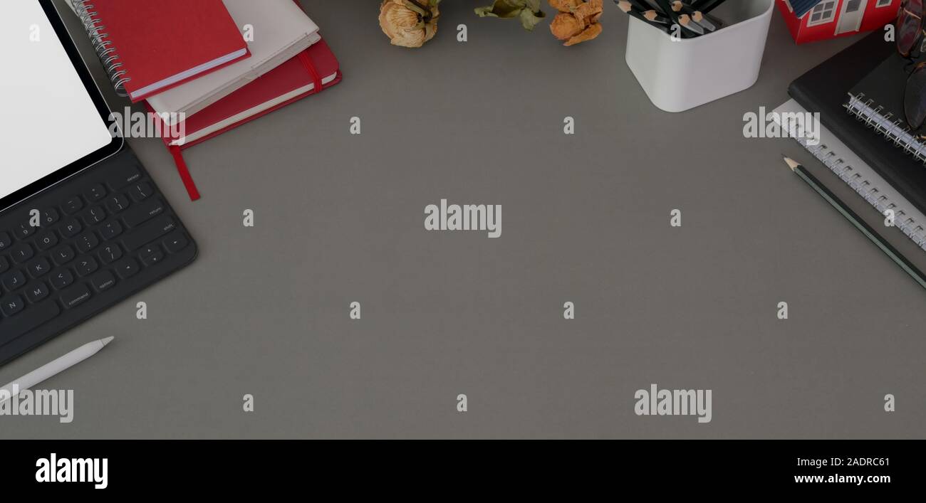 Top view of dark modern workplace with copy space and office supplies ...