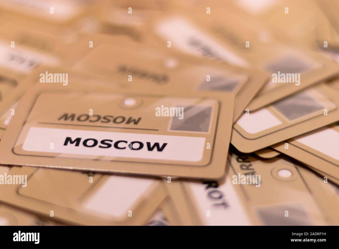 Moscow word on a yellow card, shallow depth of field. Multiple cards ...