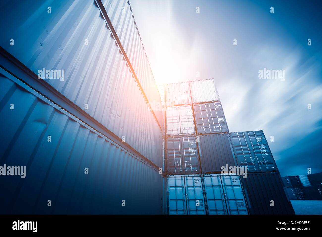 Forklift truck lifting cargo container in shipping yard or dock yard ...