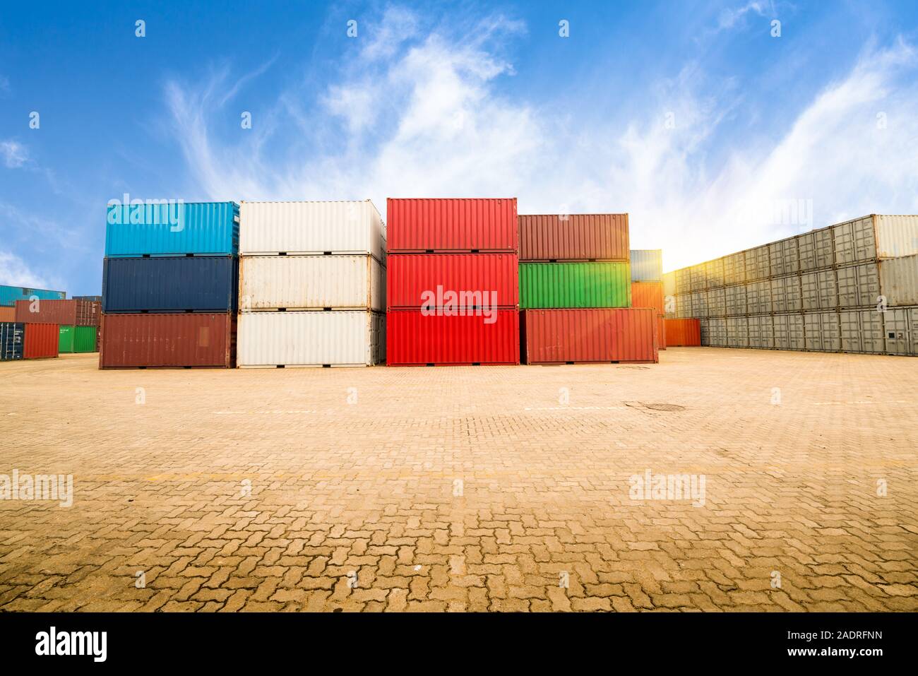 Forklift truck lifting cargo container in shipping yard or dock yard ...