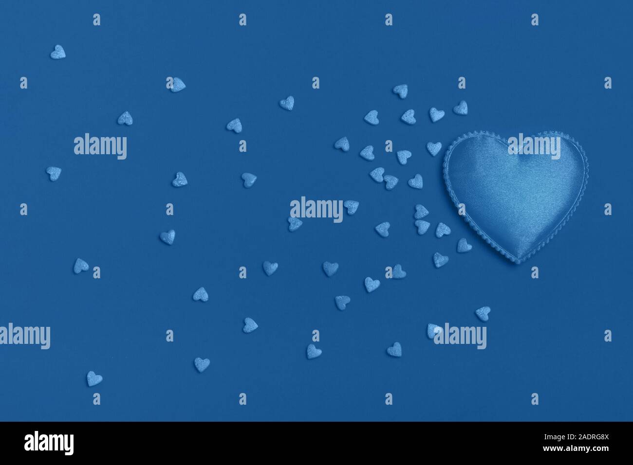 Many small hearts aspire on a blue background. Concept of love, St ...