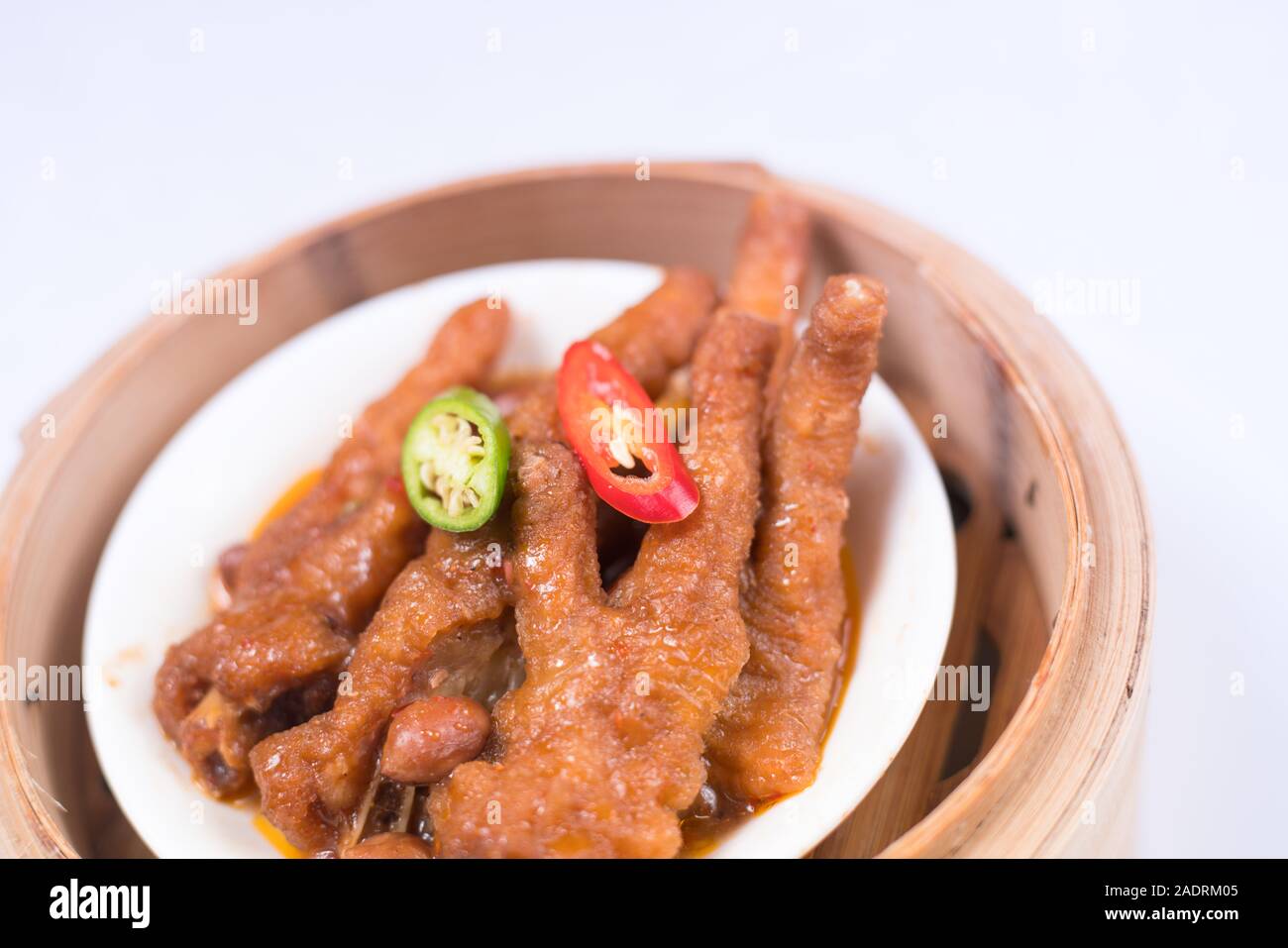 Chinese cooked chicken feet in a white plate Stock Photo - Alamy