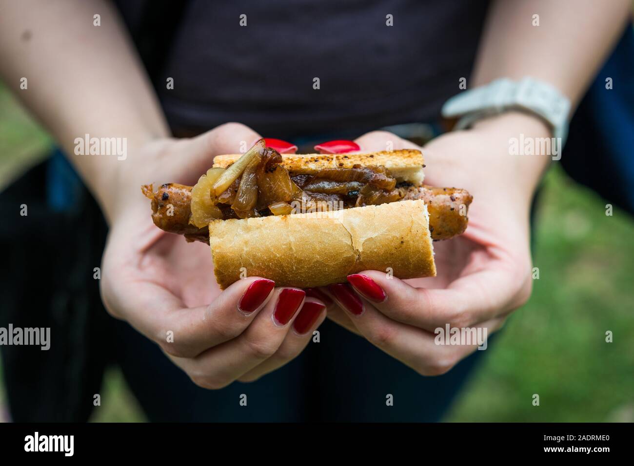 A sandwich with Spanish chistorra sausage at street food market Stock ...
