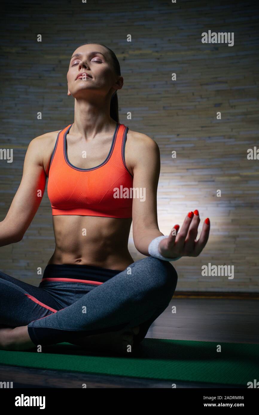 Vertical photo of slim lady meditating alone Stock Photo - Alamy