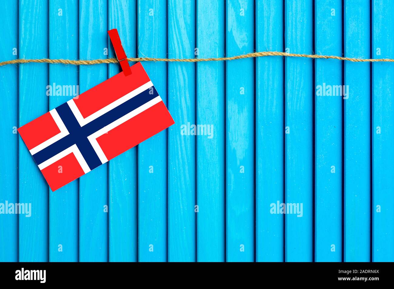 Flag of Bouvet Islands hanging on clothesline attached with wooden ...