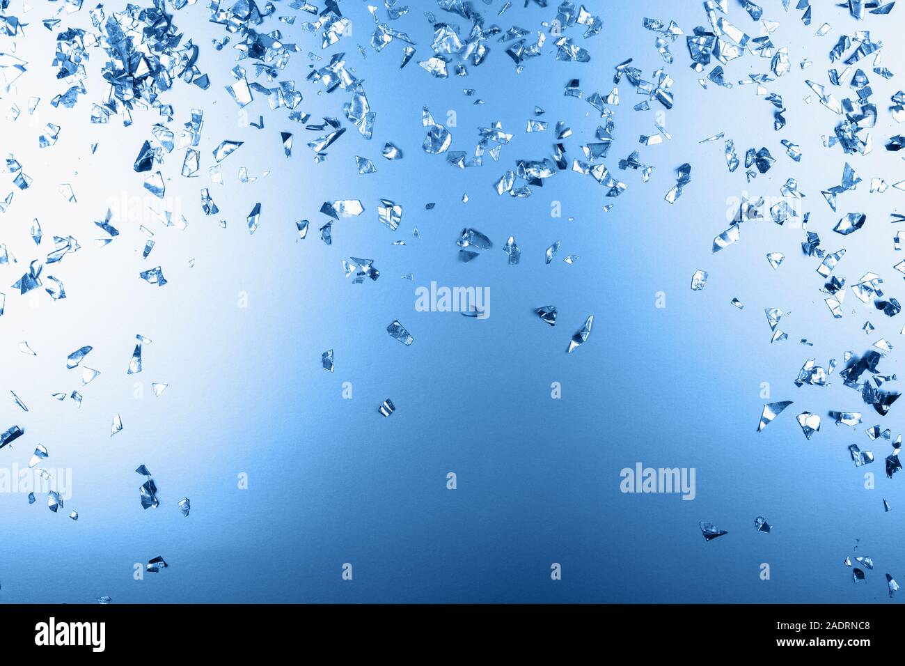 Silver falling confetti on metallic backdrop. Festive and party concept ...