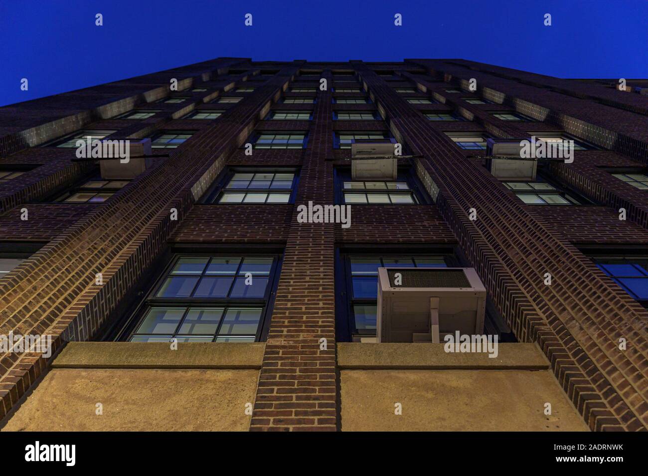Looking up at a facade of a tall brick building, on Manhattan's Upper ...