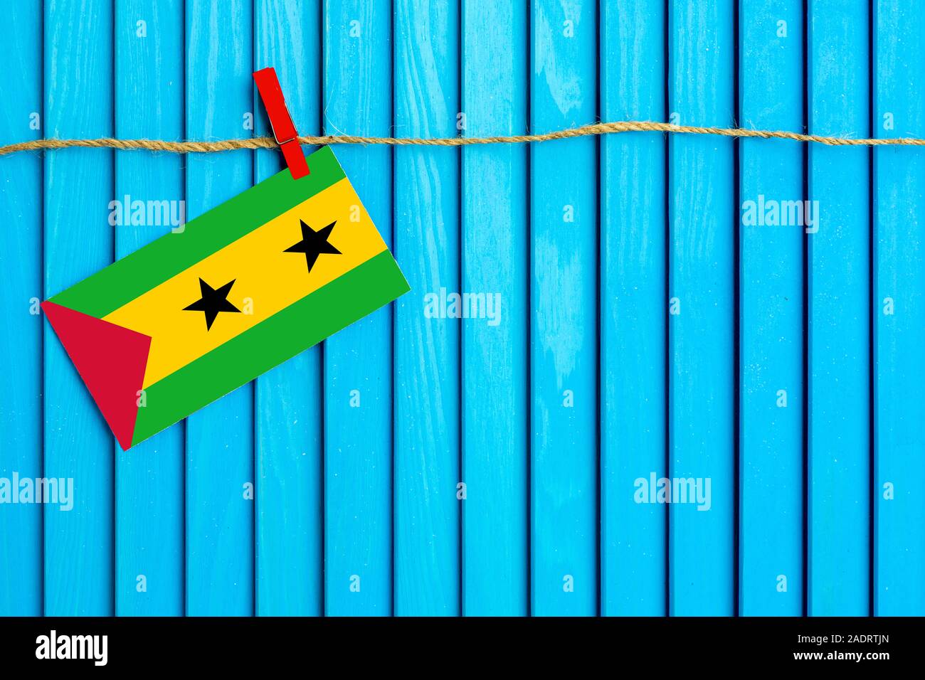 Flag of Sao Tome And Principe hanging on clothesline attached with ...