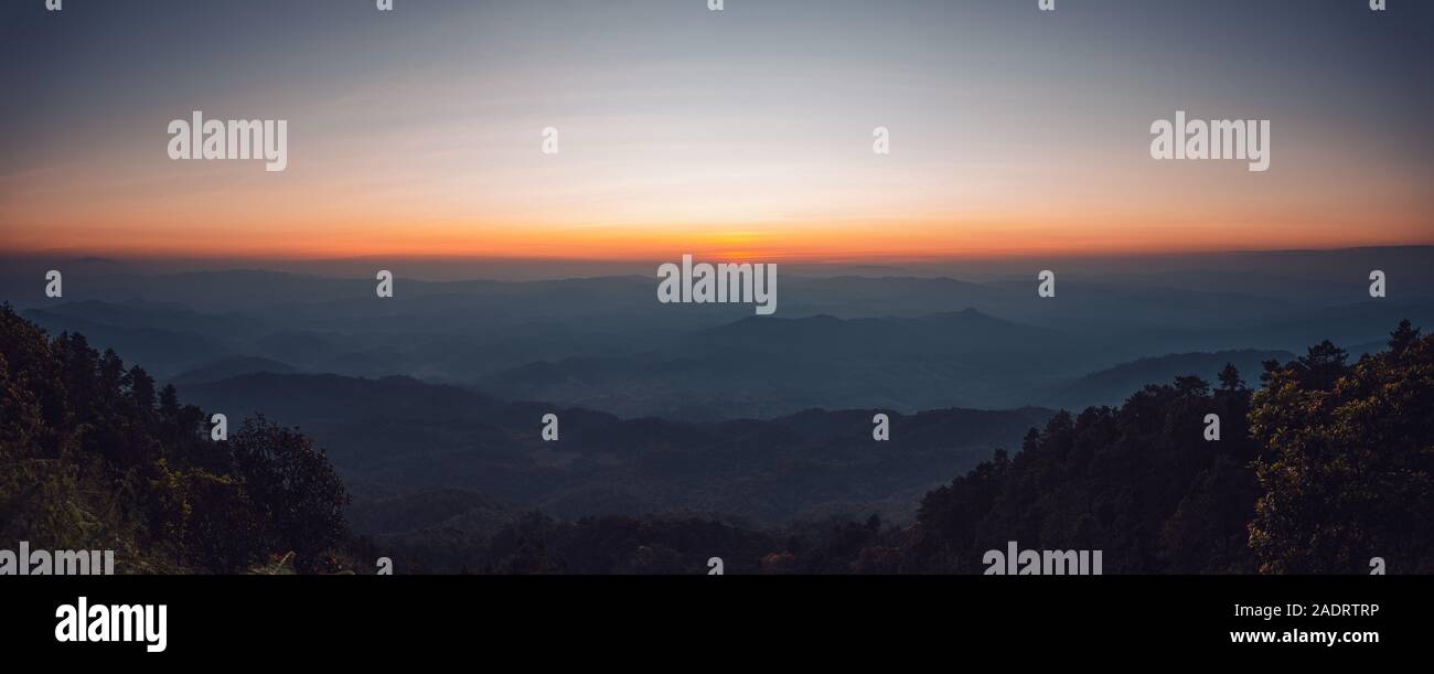 landscape mountains forests sky in the evening sunset Stock Photo - Alamy