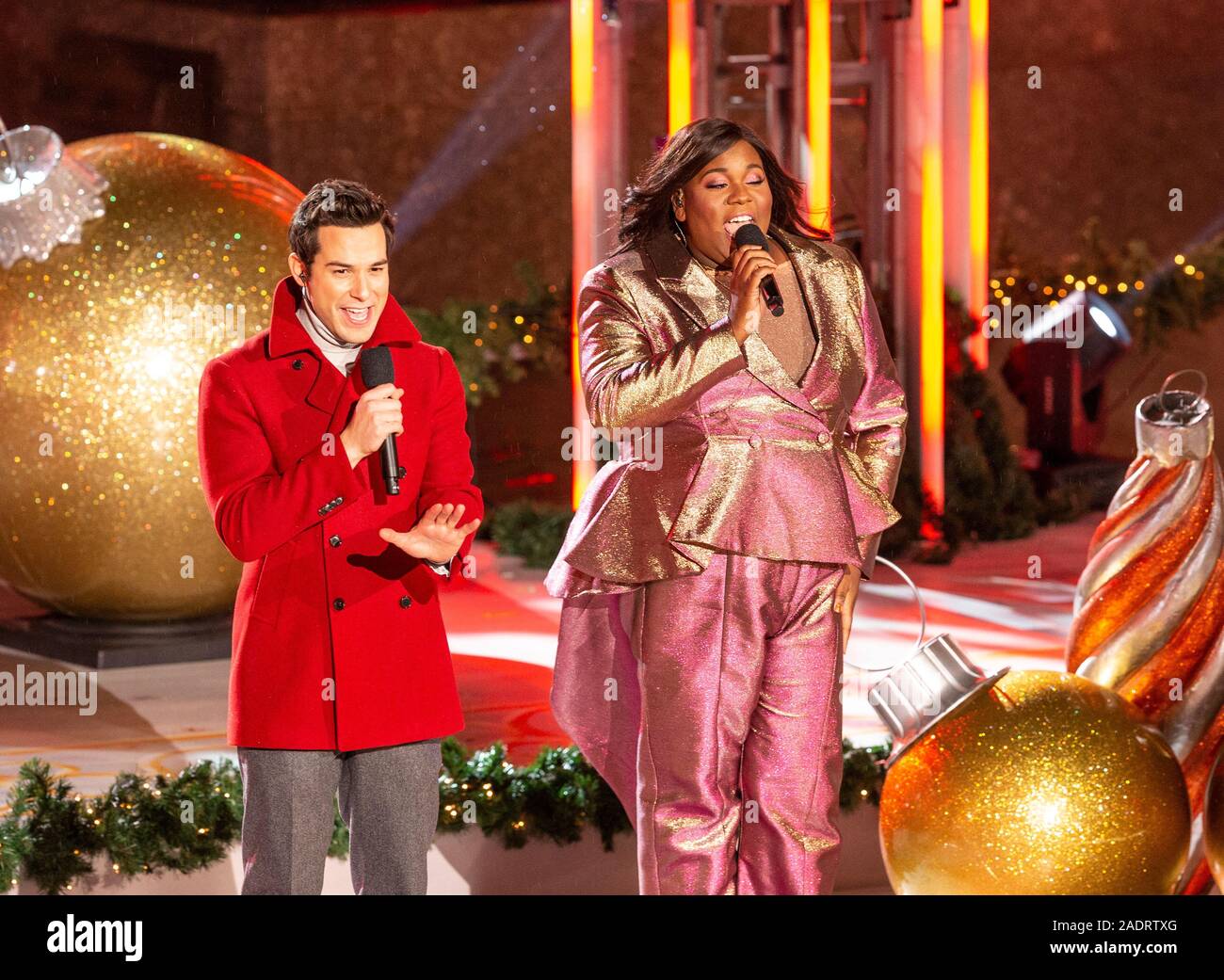 New York, NY - December 4, 2019: Skylar Astin and Alex Newell perform ...