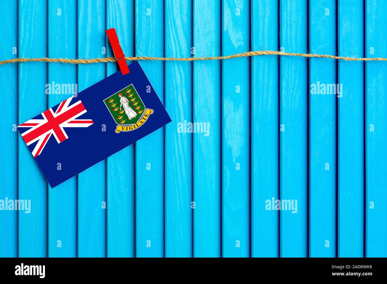 Flag of British Virgin Islands hanging on clothesline attached with ...