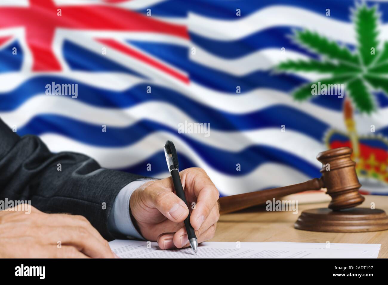 Judge writing on paper in courtroom with British Indian Ocean Territory ...