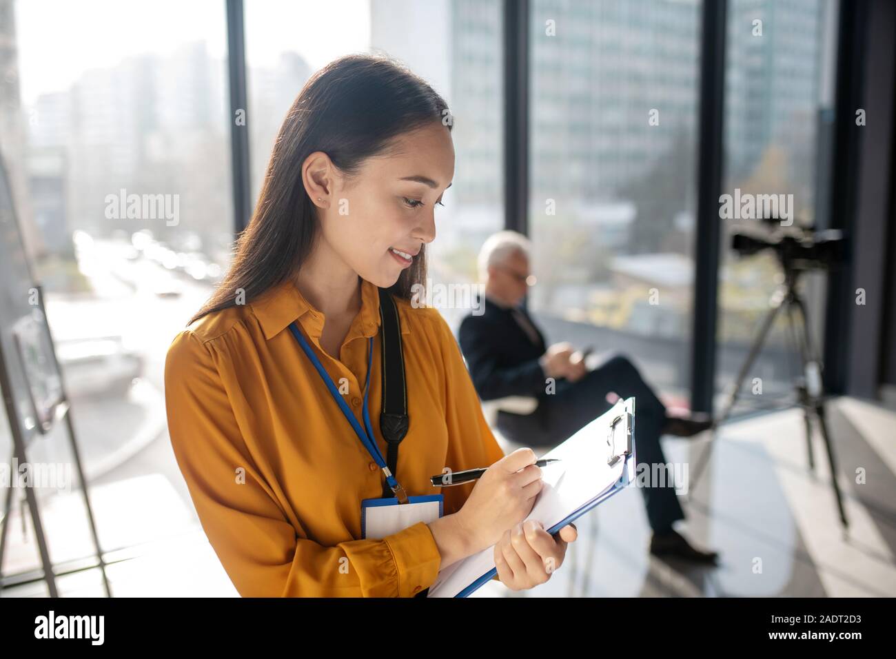 Positive woman making notes in hi-res stock photography and images - Alamy