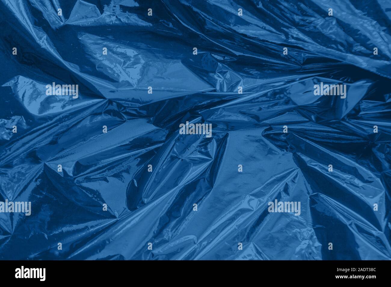 Abstract trendy dark blue colored crumpled foil texture background ...