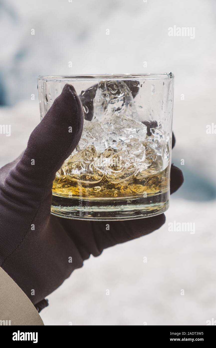 Crop discoverer with alcohol on glacier Stock Photo - Alamy