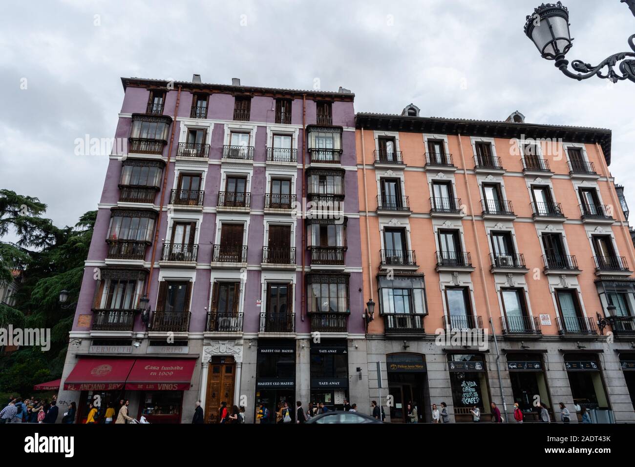 Scenic Madrid street vista with beautiful colorful buildings across the ...