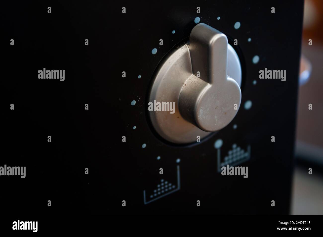 Dial knob on black background, stock photo Stock Photo - Alamy