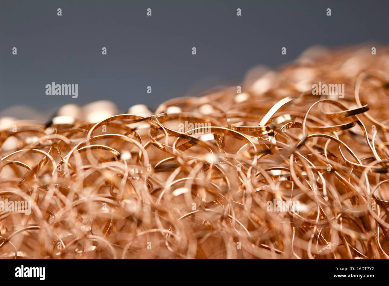 Artistic abstract background view of a macro photographed bright copper ...