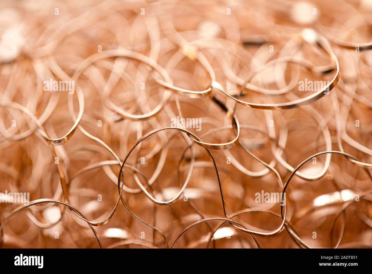 Artistic abstract background view of a macro photographed bright copper ...