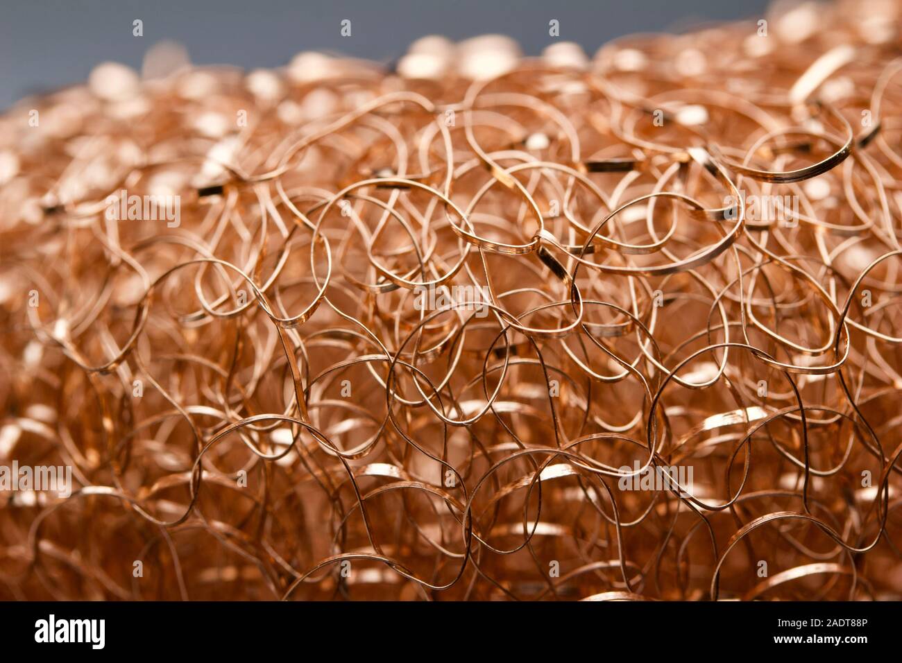 Artistic abstract background view of a macro photographed bright copper ...