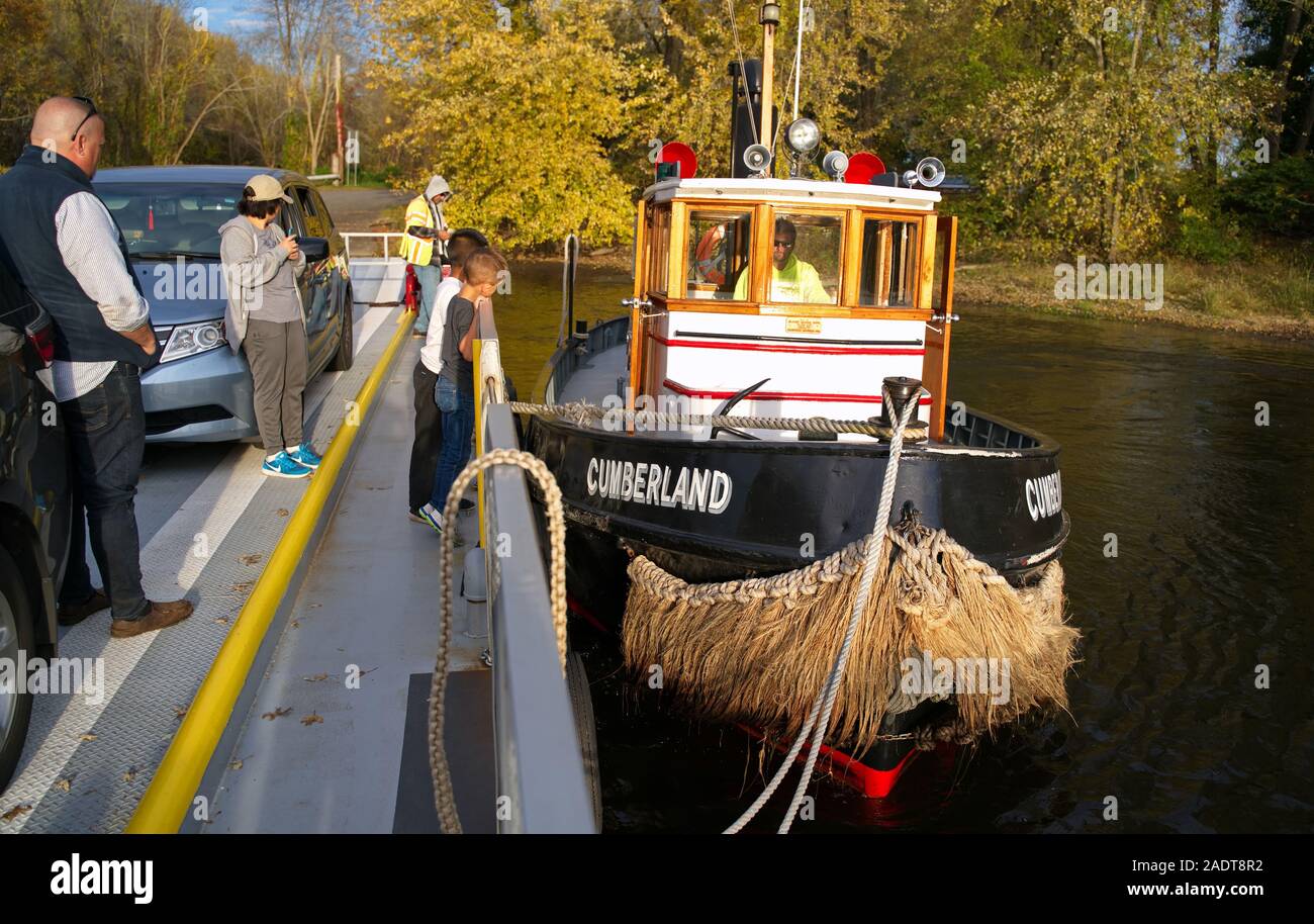 Glastonbury, CT USA. Oct 2019. Tugboat guiding car and passenger barge ...