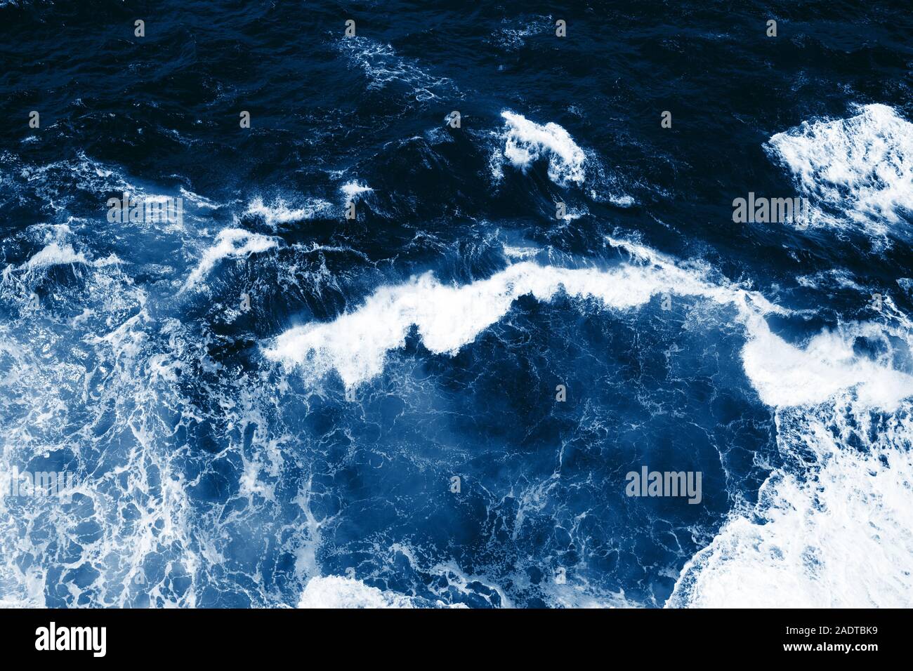 Top view on blue ocean waves and foam Stock Photo - Alamy